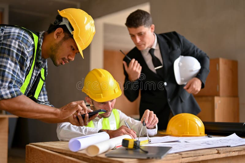 A Professional Asian Male Construction Inspector Using Scientific ...