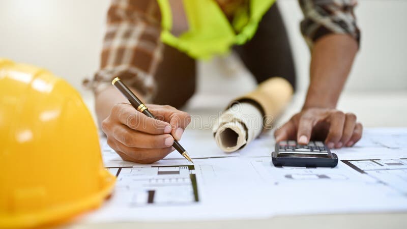 Professional Asian Male Engineer or Construction Engineer Writing ...