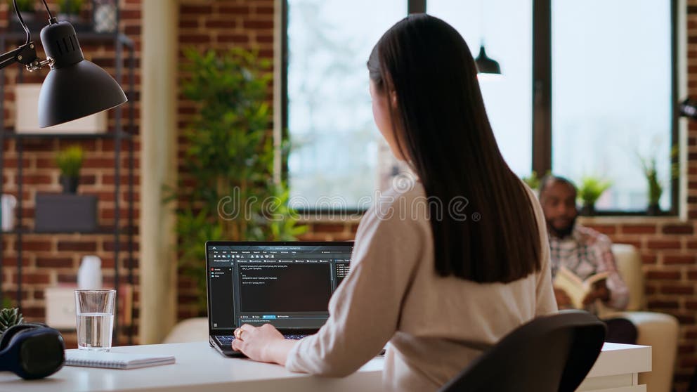 Professional Asian Software Engineer is Working Remotely Typing Code on ...