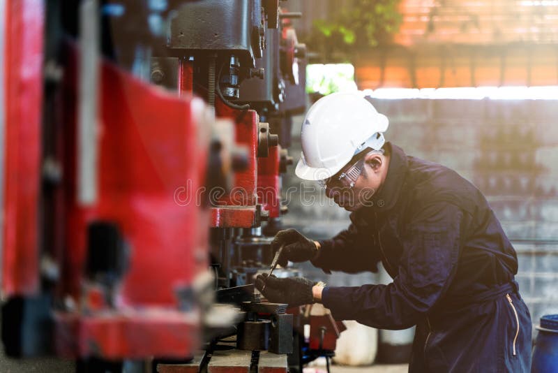 Professional Asian Worker Stand and Maintenance the Big Machine in the ...