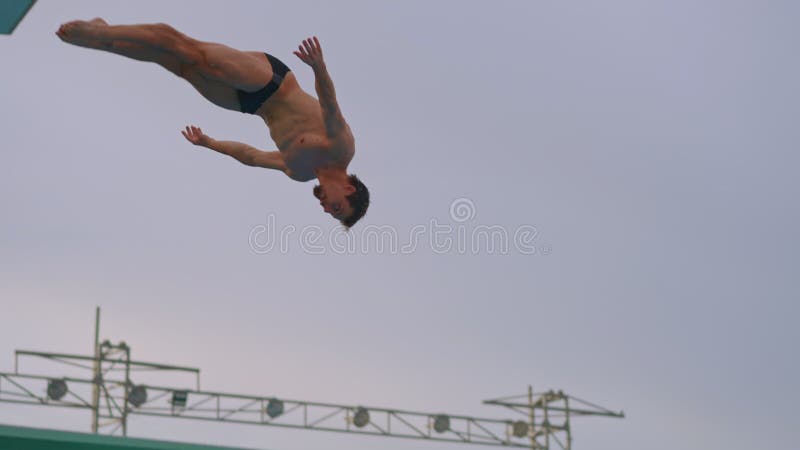 A Professional Athlete Perfects His Spring Dive during Training. the ...