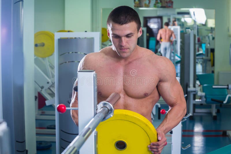 Professional Athlete Performs Exercises in the Gym Stock Photo - Image ...