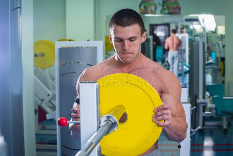 Professional Athlete Performs Exercises in the Gym Stock Image - Image ...