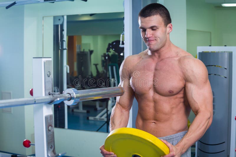 Professional Athlete Performs Exercises in the Gym Stock Image - Image ...