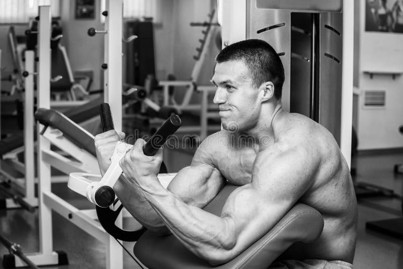 Professional Athlete Performs Exercises in the Gym Stock Photo - Image ...