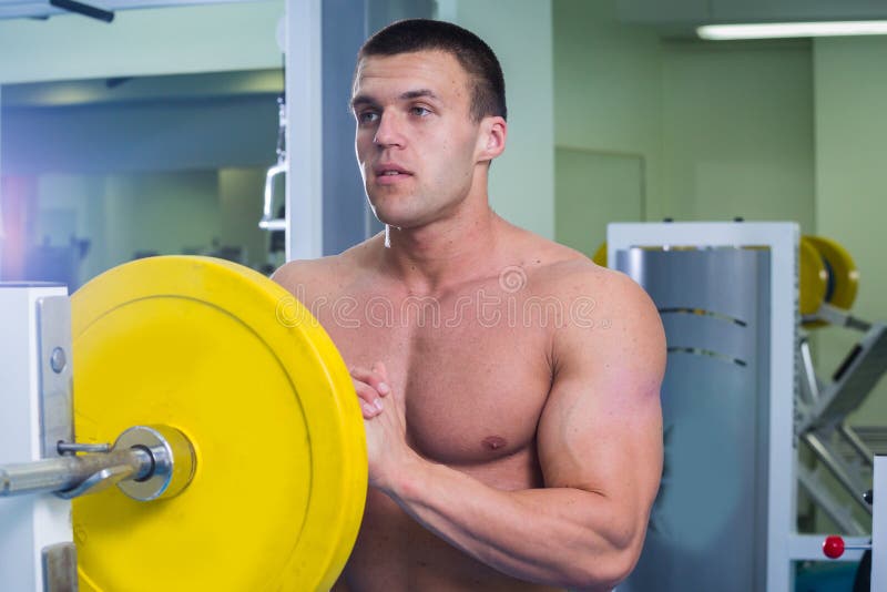 Professional Athlete Performs Exercises in the Gym Stock Photo - Image ...