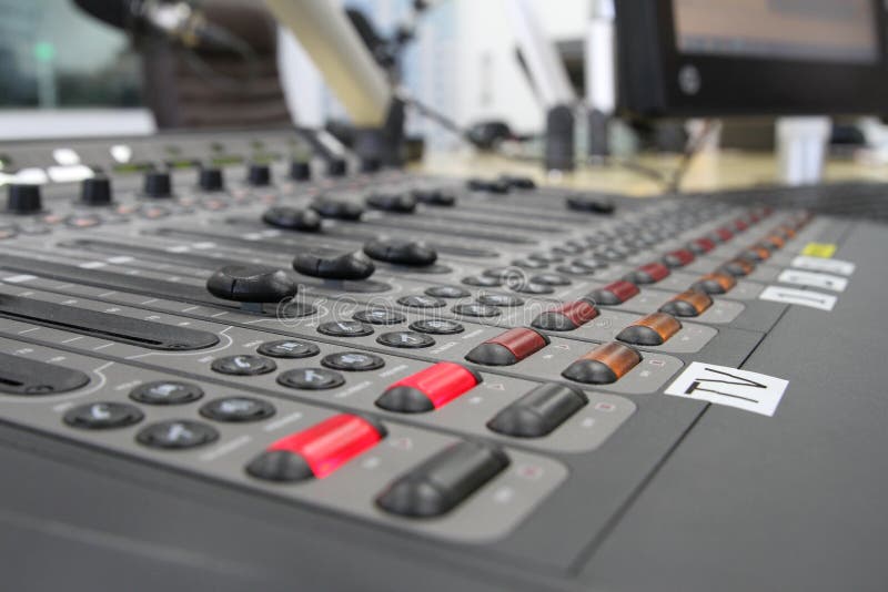 Professional Audio Operator Working on Audio Mixer Knobs during Live TV ...