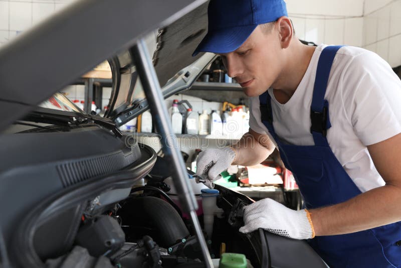 Auto Mechanic Fixing Modern Car in Service Center Stock Photo - Image ...