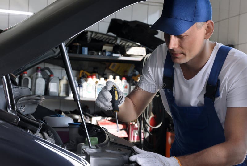 Professional Auto Mechanic Fixing Car in Service Center Stock Photo ...
