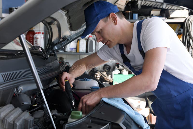 Auto Mechanic Fixing Modern Car in Service Center Stock Photo - Image ...
