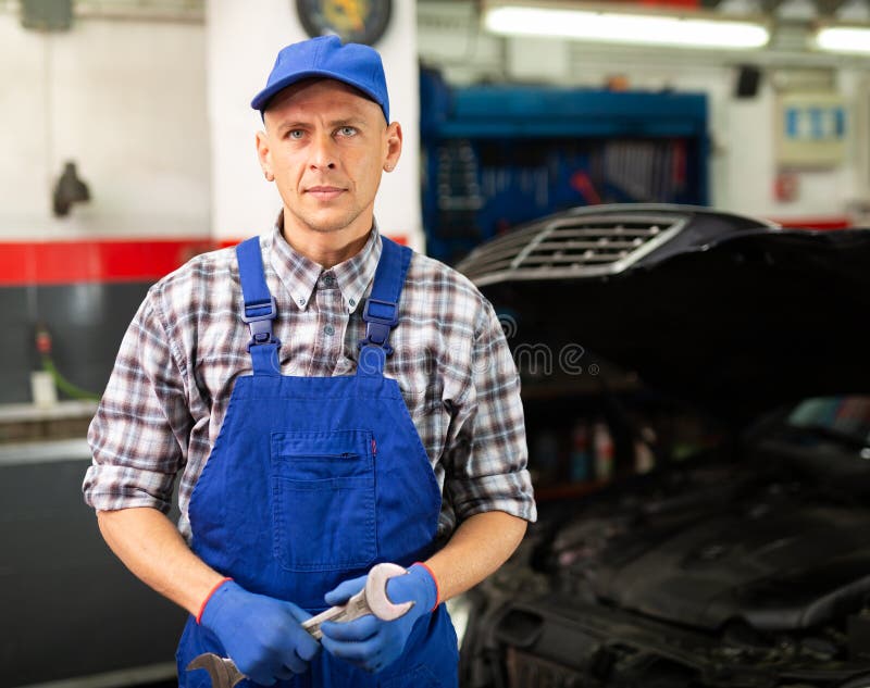 Professional Auto Mechanic Posing in Workshop Stock Photo - Image of ...