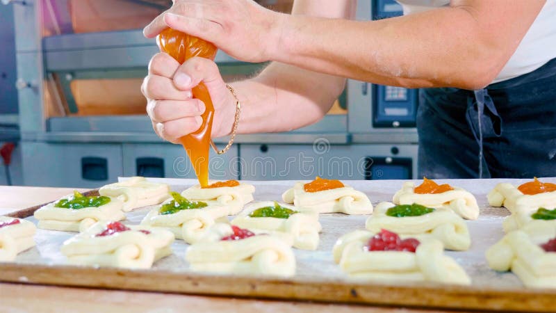 Professional Baker Adding Jam on Top of Sweet Baking before Put it into ...