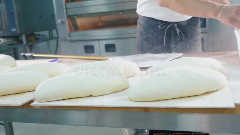Professional Fe Baker Prepares Raw Yeast Dough in a Bakery, Shaping it ...