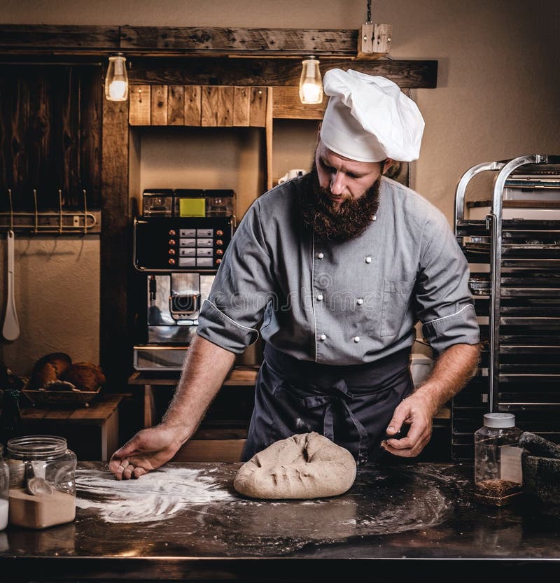 Professional Baker Preparing Bread at a Table in the Bakery. Stock ...
