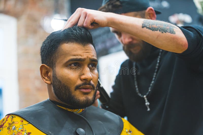 Professional Barber Styling His Happy Indian Clientand X27 S Hair In