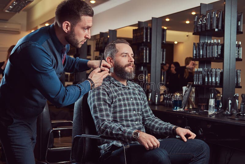 Professional Barber Working with a Client in a Hairdressing Salon ...