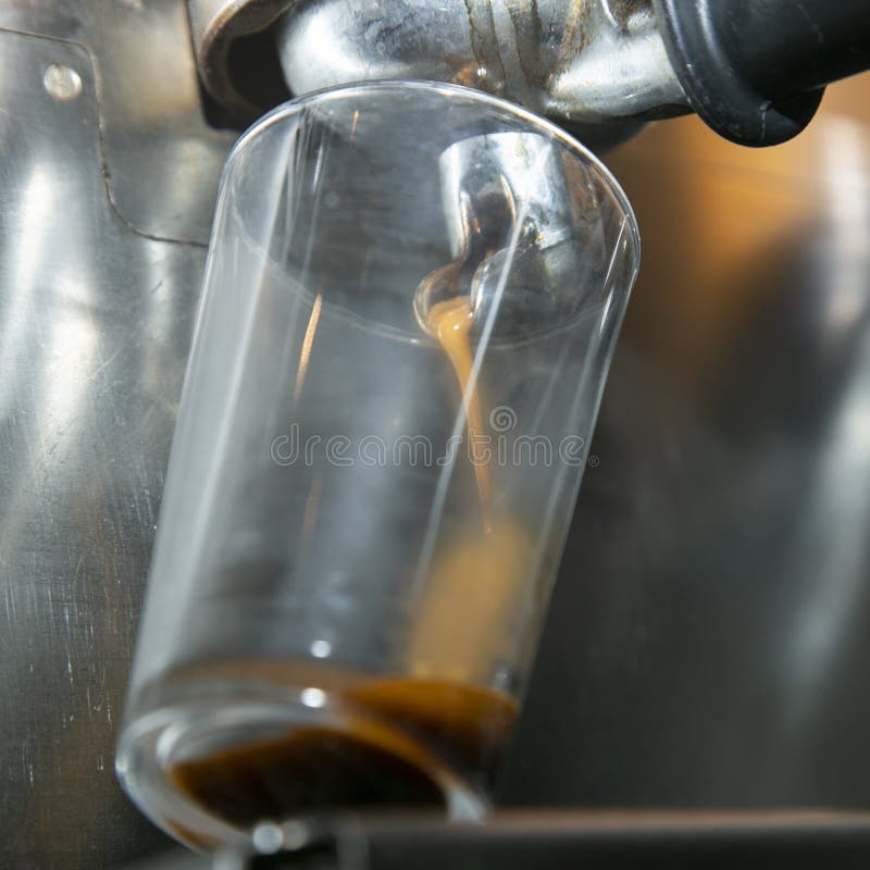 Professional Barista Working with a Coffee Machine and Preparing Hot ...