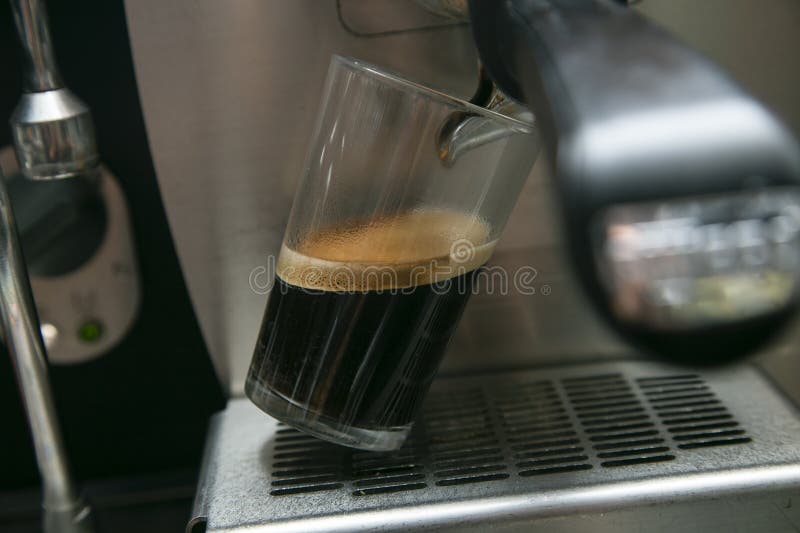 Professional Barista Working with a Coffee Machine and Preparing Hot ...