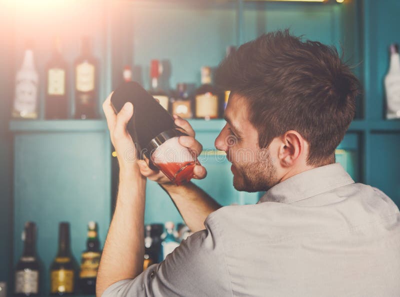 Bartender Mixing Alcoholic Cocktail in Shaker Stock Photo - Image of ...