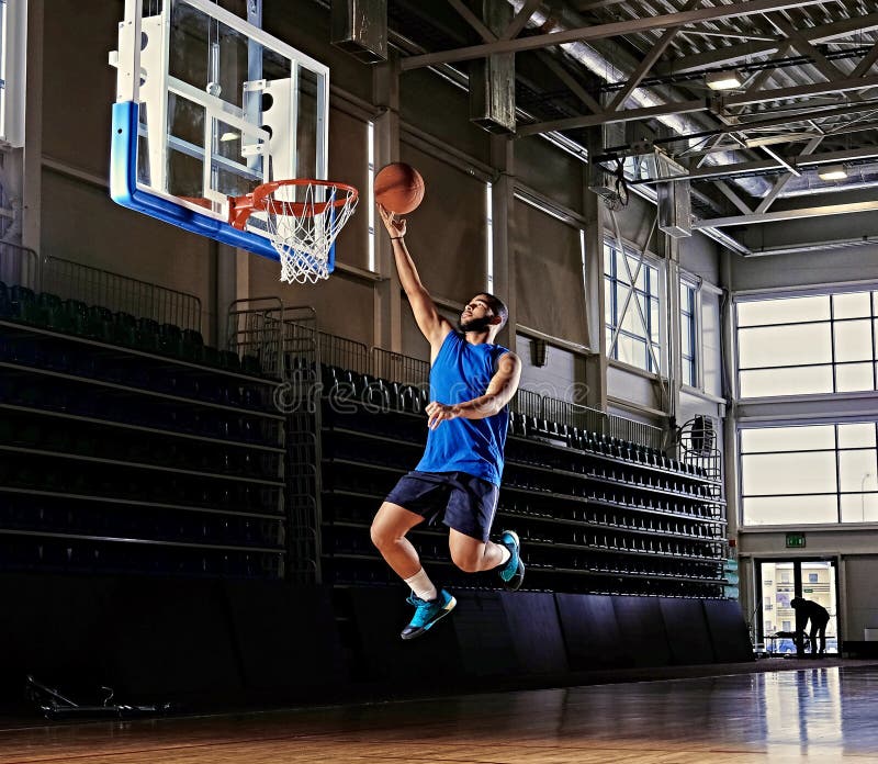 Professional Basketball Player in Action on a Basketball Field. Stock ...