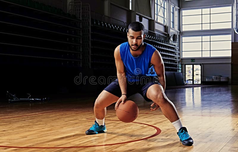Professional Basketball Player in Action on a Basketball Field. Stock ...