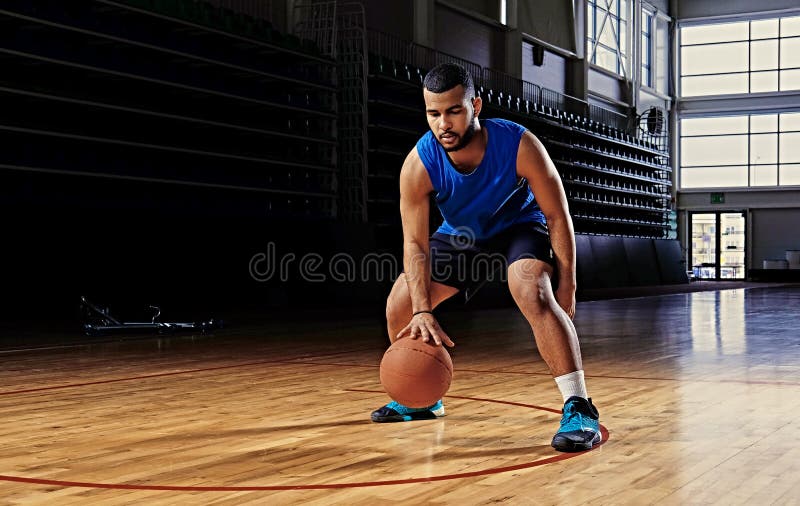 Professional Basketball Player in Action on a Basketball Field. Stock ...