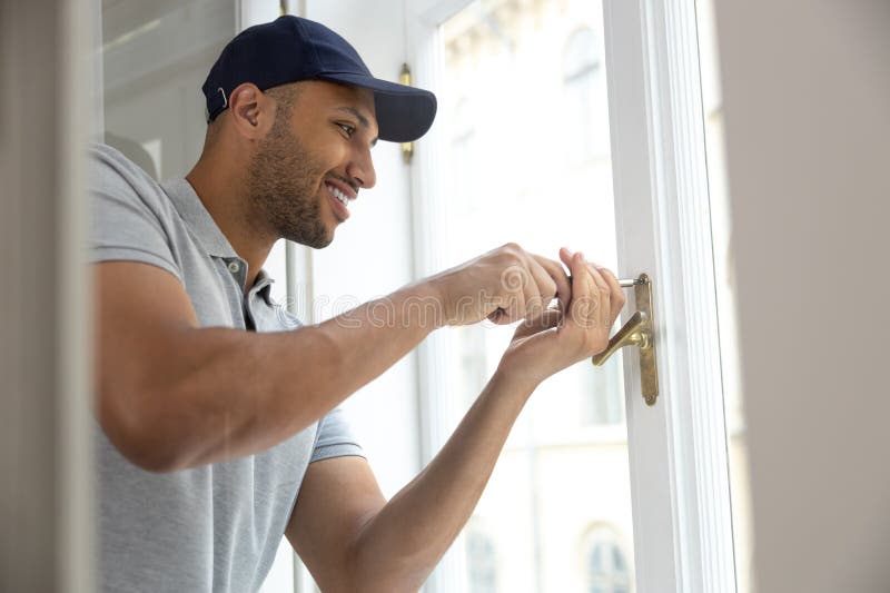 Professional Handyman Fixing Window Handle at Home. Stock Image - Image ...