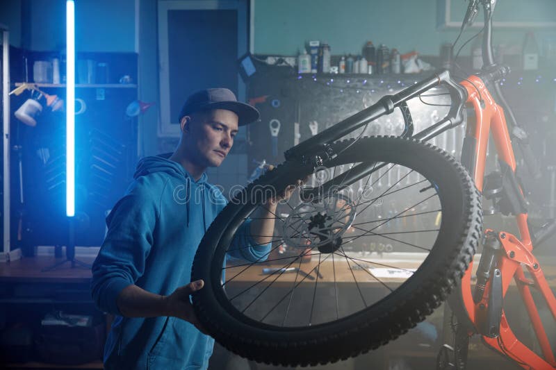 Professional Bicycle Mechanic Installing Front Wheel at Workshop Stock ...