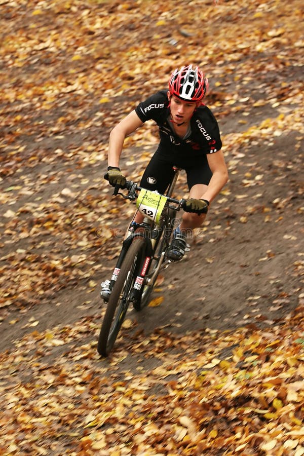 Professional DH Biker is Riding a Mountain Bike on the Trail of ...