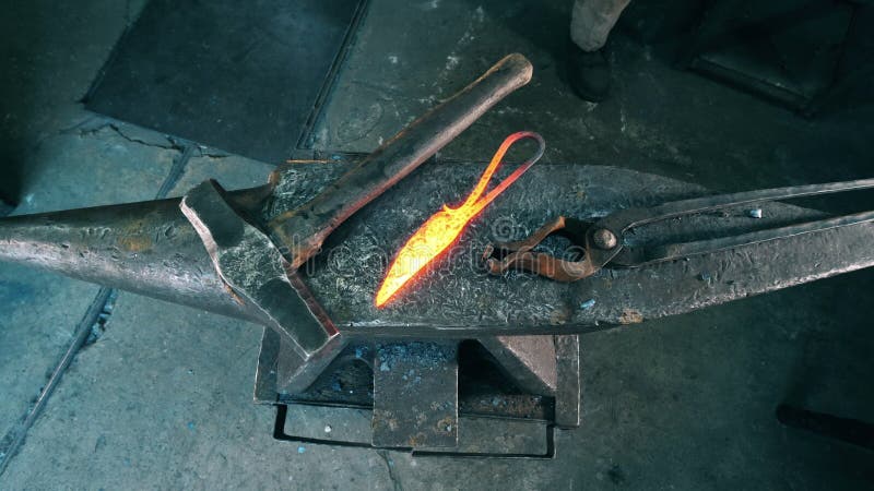 Professional Blacksmith Puts Hot Knife on Anvil at a Forge. Stock Video ...