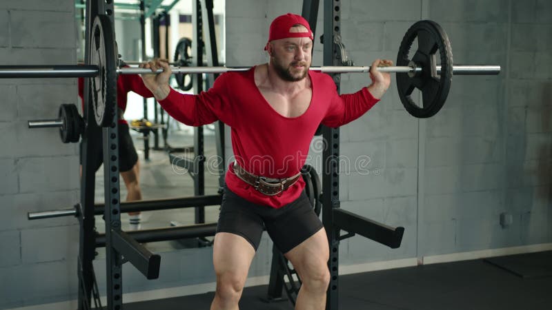 Professional Bodybuilder Squats with a Barbell in the Gym Stock Footage ...