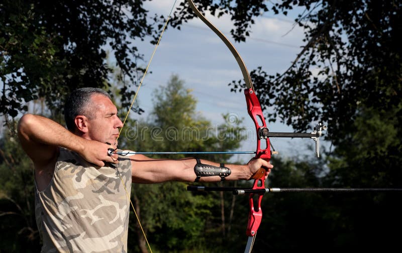 Portrait Of Bowman Aiming With Bow And Arrow Stock Image - Image of ...