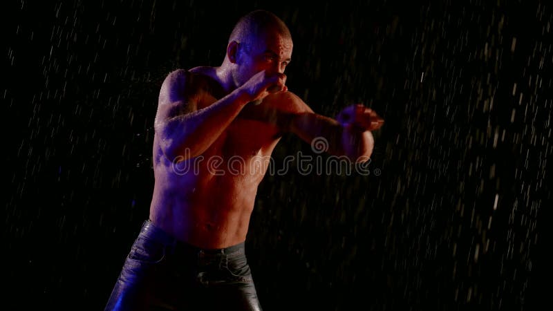 Professional Boxer or Kickboxer is Fighting with Imaginary Enemy in ...