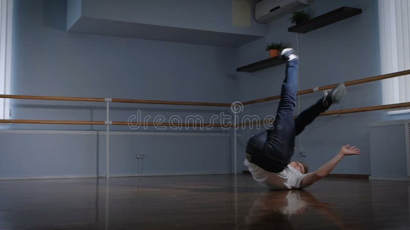 Professional Breakdancer Performs Complex Dance Exercise on the Floor ...