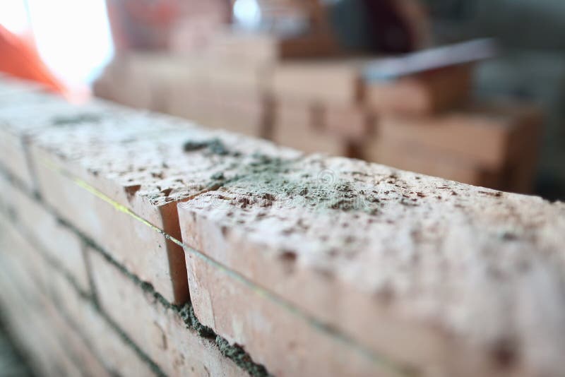 Professional brick laying stock image. Image of measure - 149506375