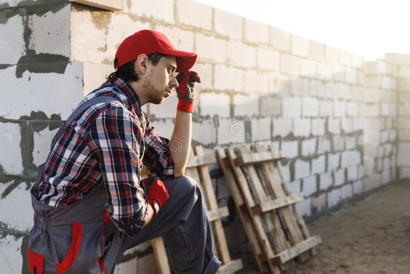 Professional Bricklayer Man at the Construction Site Stock Photo ...