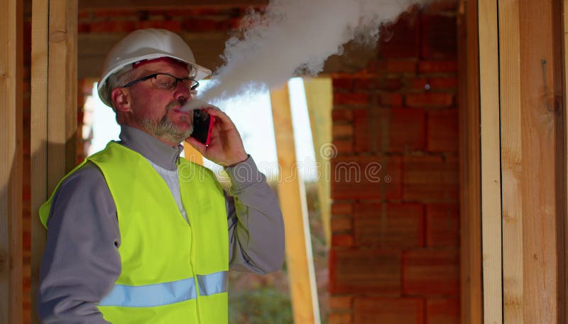 Professional Builder Architect Talking on Mobile Phone To Control ...