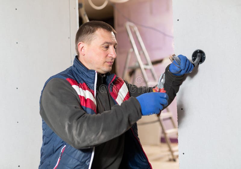 Professional Builder Engaged in Electrical Installation Work at Indoors ...