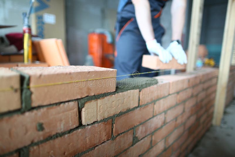 Professional Builder Lays Bricks and Builds a Wall in Apartment Stock ...