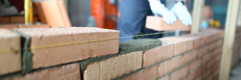 Professional Builder Lays Bricks and Builds a Wall in Apartment Stock ...