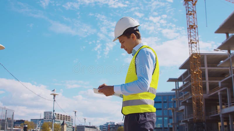 Professional Builder Standing in Front of Construction Site. Foreman in ...