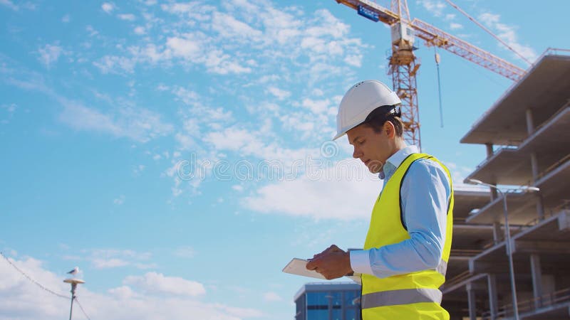 Professional Builder Standing in Front of Construction Site. Foreman in ...