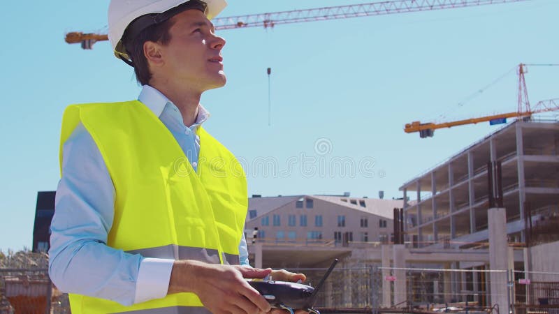 Professional Builder Standing in Front of Construction Site. Foreman in ...