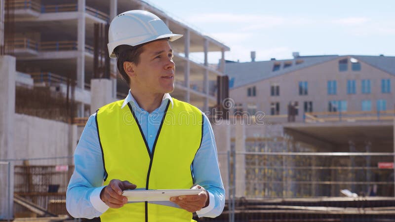 Professional Builder Standing in Front of Construction Site. Foreman in ...