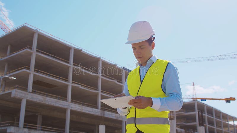 Professional Builder Standing in Front of Construction Site. Foreman in ...