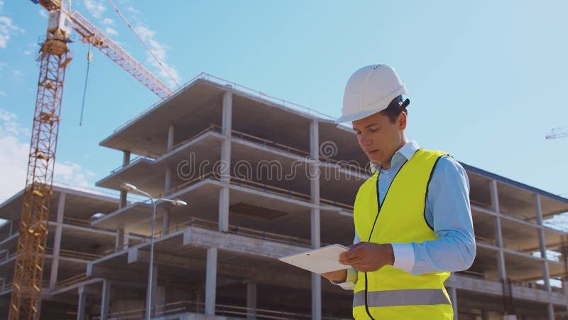 Professional Builder Standing in Front of Construction Site. Foreman in ...