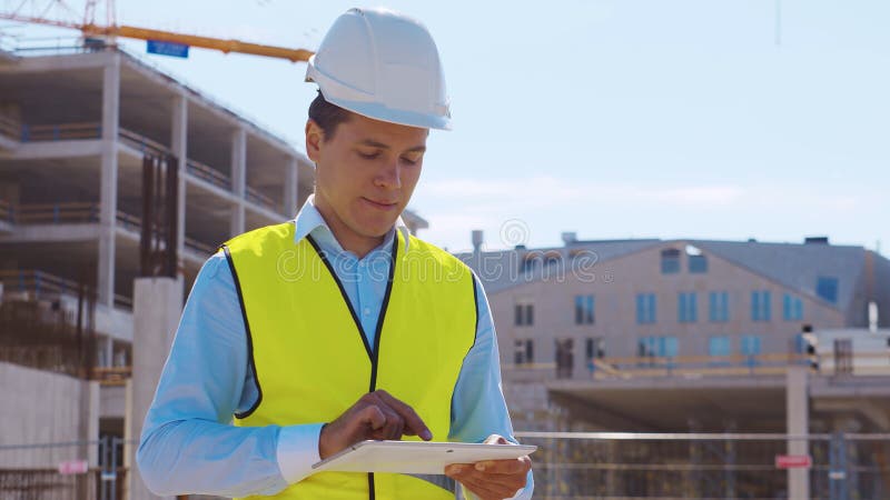 Professional Builder Standing in Front of Construction Site. Foreman in ...