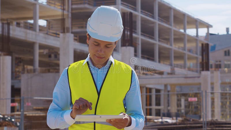 Professional Builder Standing in Front of Construction Site. Foreman in ...