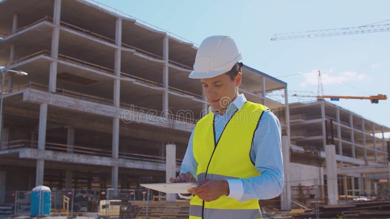 Professional Builder Standing in Front of Construction Site. Foreman in ...