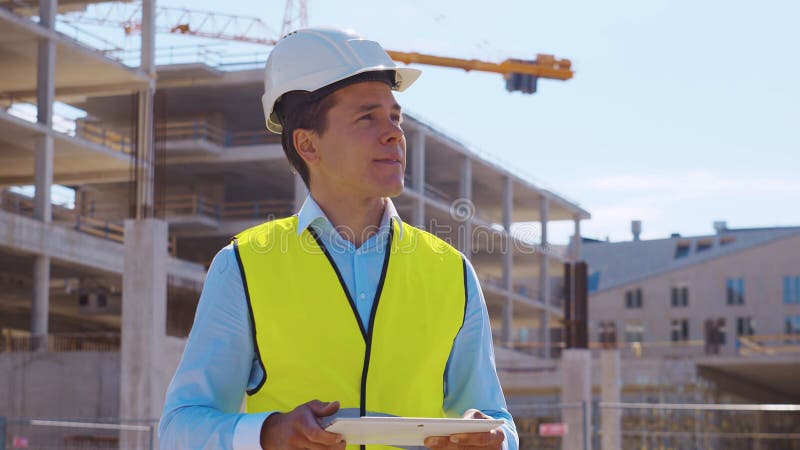 Professional Builder Standing in Front of Construction Site. Foreman in ...